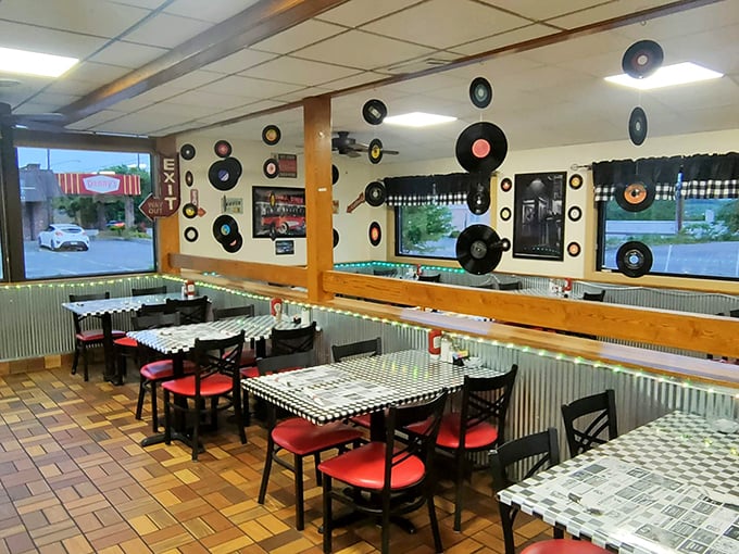 Vinyl records transform ordinary walls into a musical time capsule, creating the perfect backdrop for comfort food conversations.