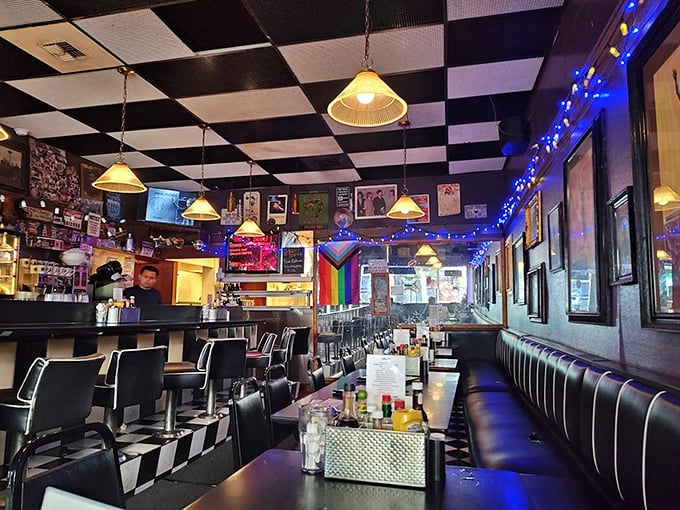 Classic black and white checkerboard ceilings hover above vinyl booths where Seattle's stories unfold daily. It's like a time capsule where your coffee cup never empties.