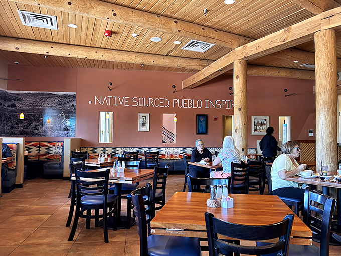 Massive wooden vigas frame a dining room where "Native Sourced Pueblo Inspired" isn't just wall decor&mdash;it's the delicious mission statement you're about to taste.