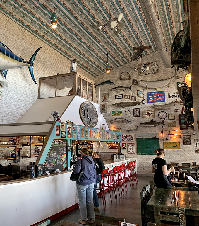 Nautical treasures adorn every inch of wall space, creating the perfect backdrop for seafood feasts under a ceiling that whispers tales of Great Lakes adventures.