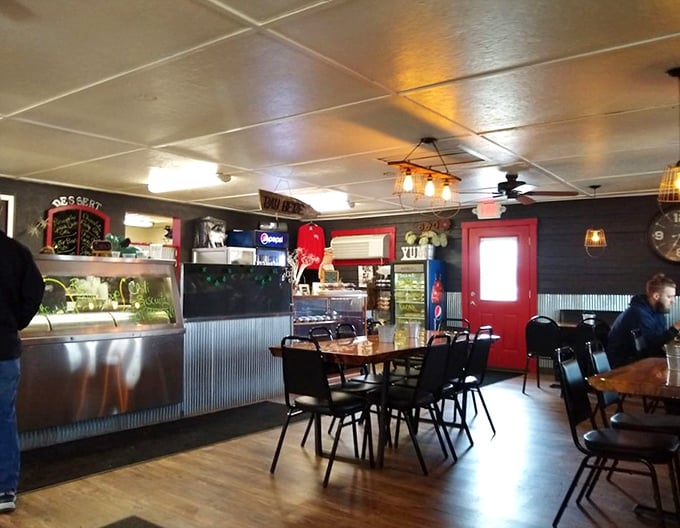Inside, corrugated metal meets warm wood tones, creating that perfect "we care about the food, not the frills" atmosphere every great BBQ joint needs.