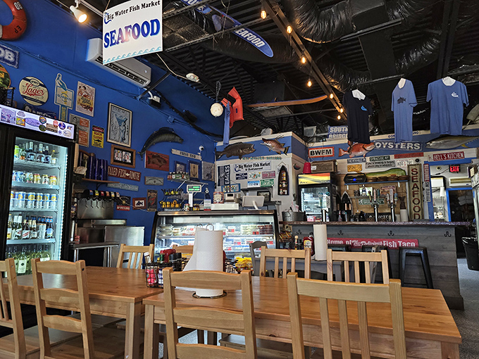 Inside, the vibrant blue walls serve as the perfect backdrop for a seafood shrine where fishing memorabilia tells stories of the Gulf's bounty.