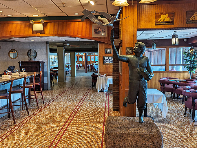 Warm wood paneling and nautical touches create the perfect backdrop for seafood indulgence. That bronze fisherman has witnessed countless "this is the best fish I've ever had" moments.