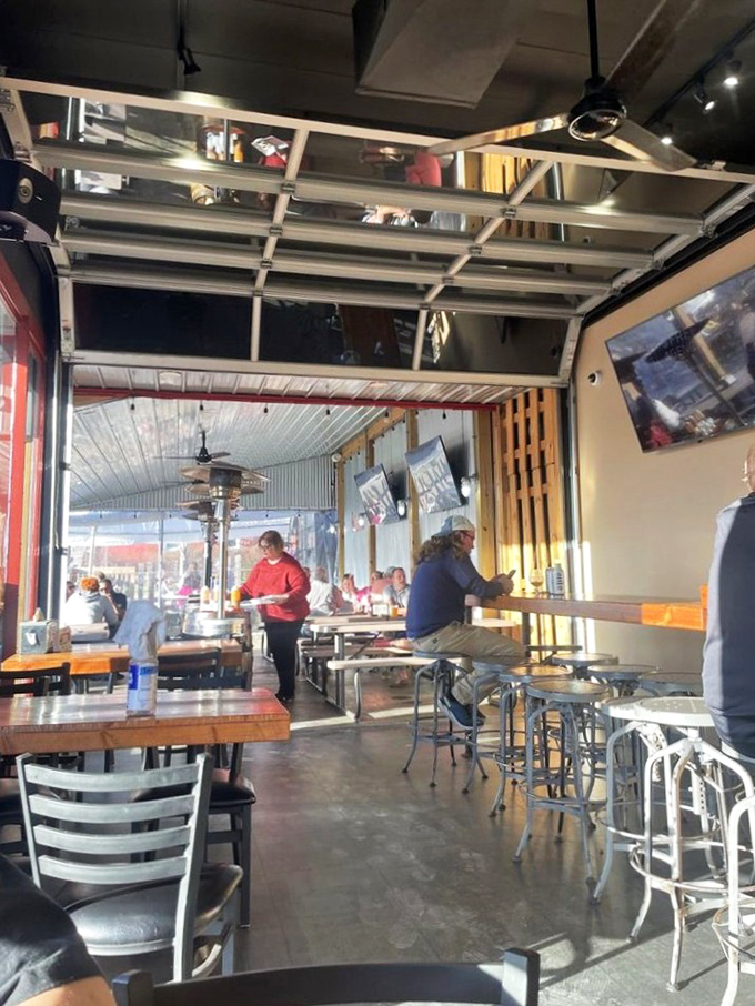 Industrial-chic meets comfort inside, where garage doors open to create that perfect indoor-outdoor vibe when Pennsylvania weather cooperates.