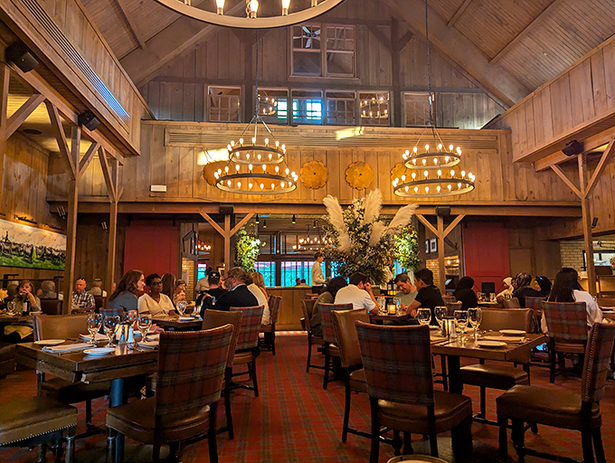 Soaring wooden beams and circular chandeliers create a cathedral-like space where steak is the religion everyone follows.