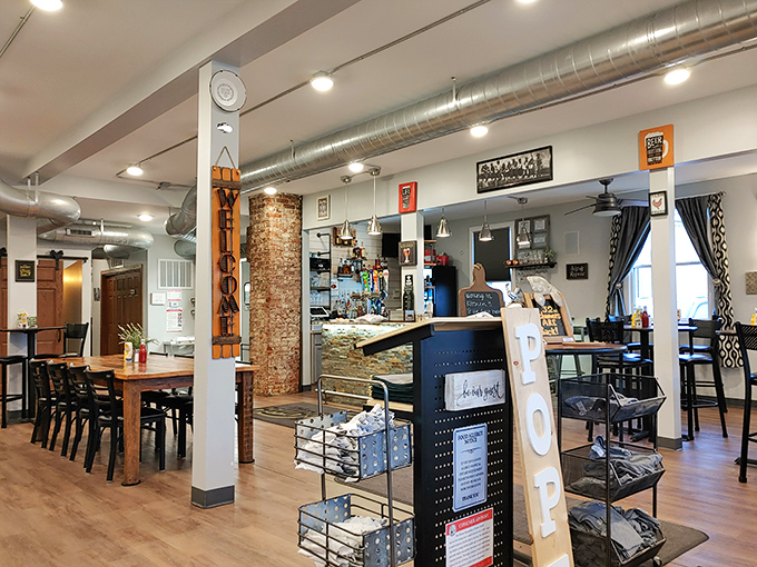 Step inside to discover a bright, welcoming space where exposed ductwork meets homey charm – industrial chic meets Midwest hospitality.