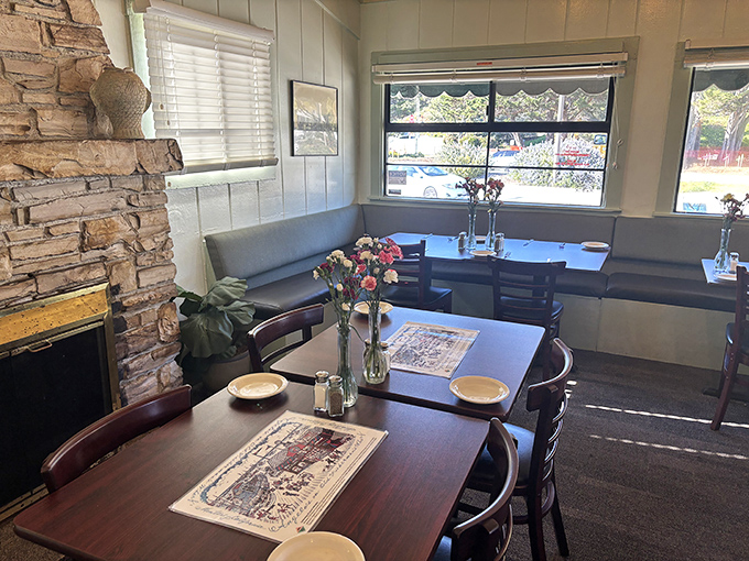 Stone fireplace, cozy booths, and paper placemats&mdash;this dining room feels like the coastal grandmother's house we all wish we had in the family.