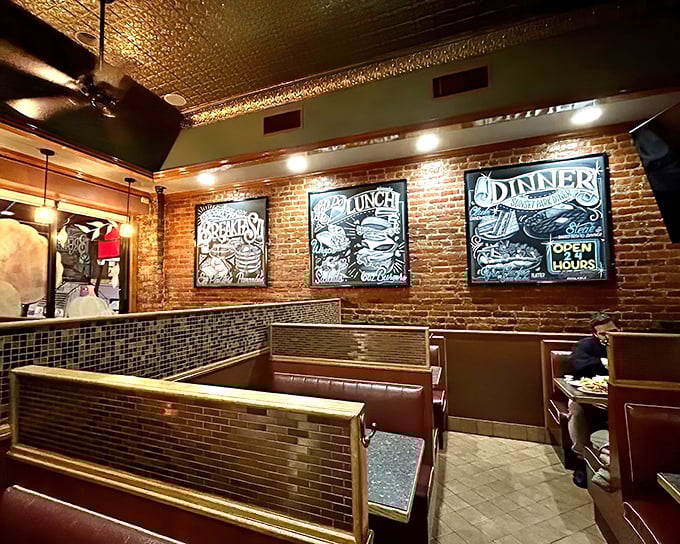 Classic diner booths against exposed brick walls create that perfect blend of nostalgia and Brooklyn cool. Breakfast tastes better in vinyl booths.