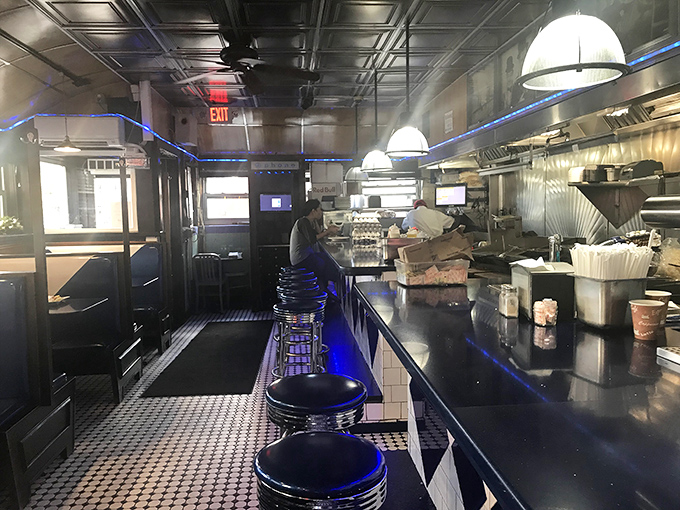 The classic diner counter where dreams and hash browns are made. Blue neon lighting adds that perfect touch of urban cool.
