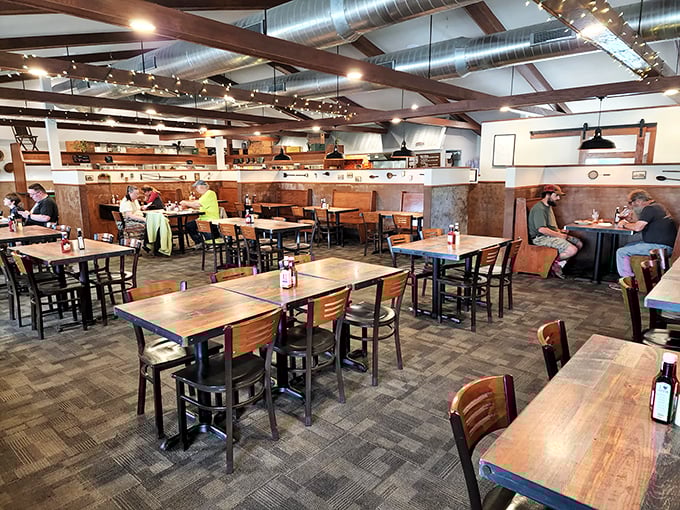 Wooden beams, exposed ductwork, and warm lighting create that perfect "come as you are, stay as long as you want" atmosphere that makes midwestern dining so irresistible.