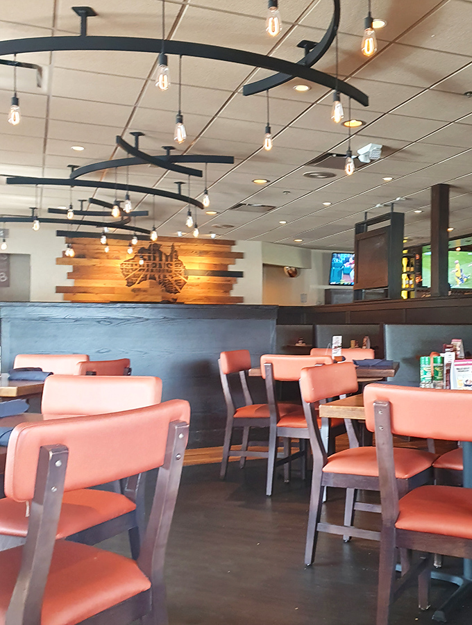 Edison bulbs cast a warm glow over coral-colored booths, while the wooden Australia map reminds you this isn't your average Virginia dining room.