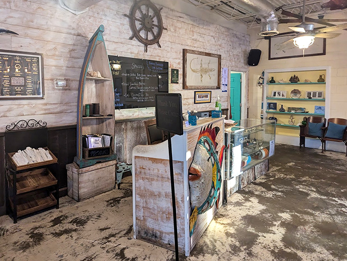 Nautical charm meets functional simplicity in this reception area, where boat-shaped shelving reminds you exactly where your dinner came from.