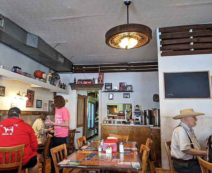 Inside, time slows down as locals gather at wooden tables beneath vintage fixtures, where conversations flow as freely as the coffee.