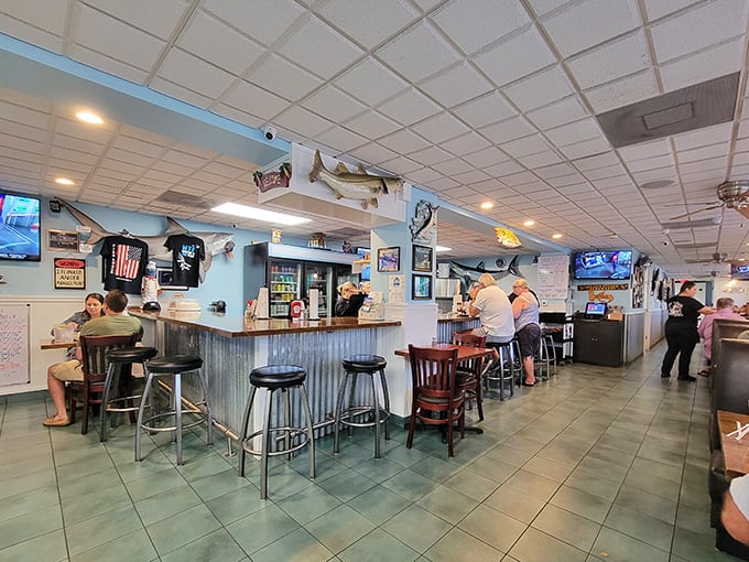 Turquoise beams and wooden accents create that perfect "coastal casual" vibe where both flip-flops and fancy shoes feel equally at home.