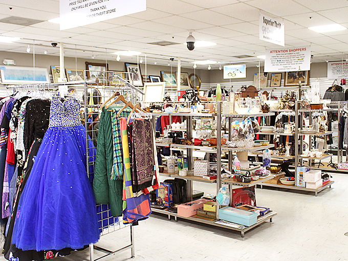 A sparkling blue prom dress waits for its second chance at magic, surrounded by a kaleidoscope of potential memories.