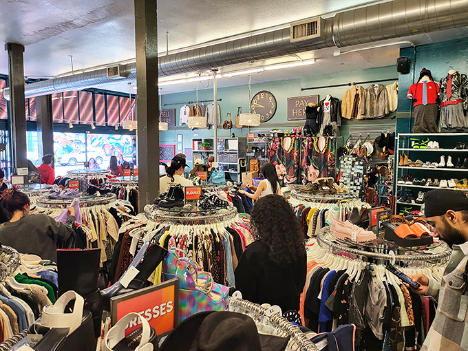 Fashion archaeology in action. Shoppers navigate circular racks with the focus of diamond hunters, each hoping to unearth their next signature piece.