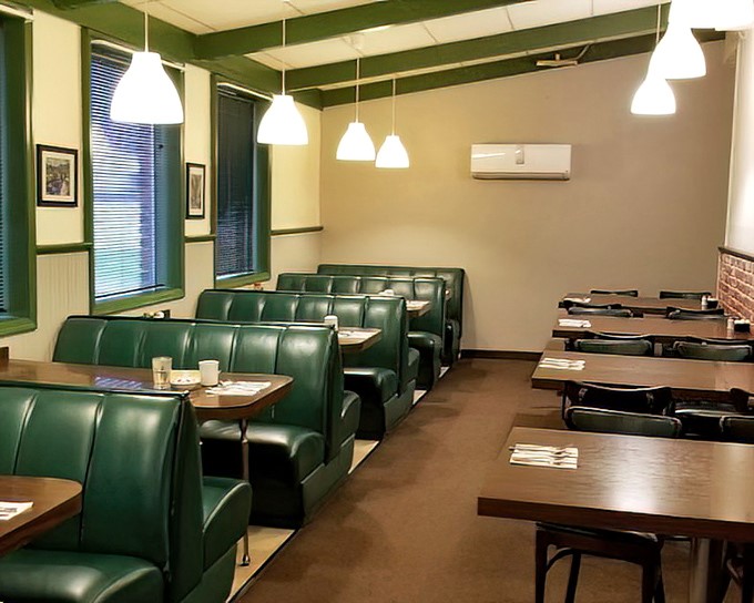 Classic green vinyl booths invite you to slide in and stay awhile. This isn't Instagram-bait d&eacute;cor&mdash;it's the real deal comfort of a beloved local institution.