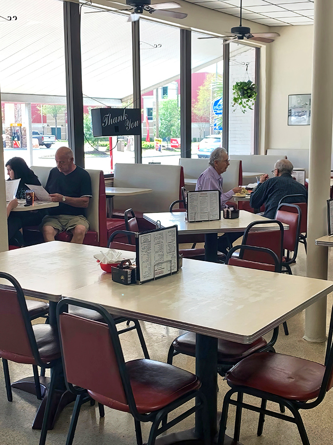 Where conversations flow as freely as the coffee. These red vinyl booths have witnessed decades of Pensacola's morning rituals and lunchtime confessions.