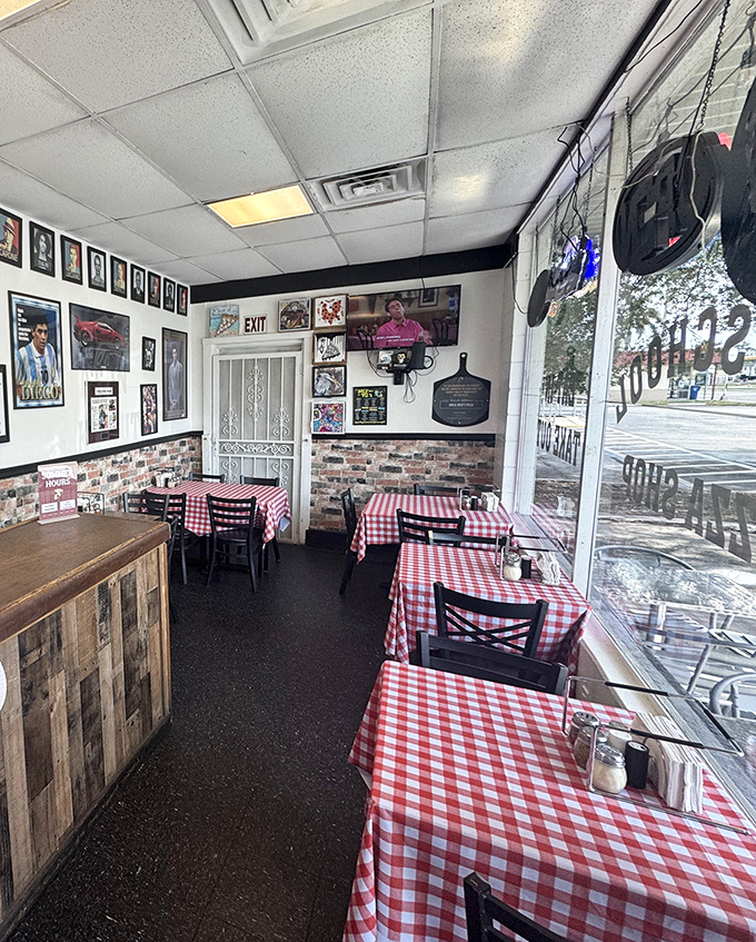 Classic red and white checkered tablecloths signal you've arrived at pizza paradise. The walls tell stories while you wait for your slice of heaven.