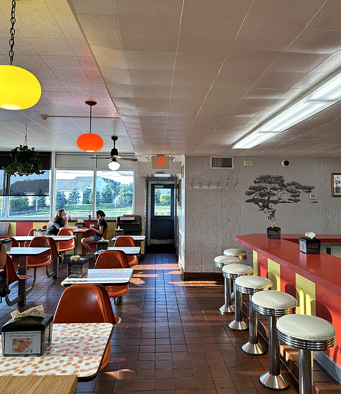 Time travel isn't just science fiction—it's what happens when you step into Speck's retro interior with those unmistakable orange chairs and pendant lights.