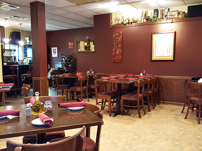 Step inside and time slows down. The warm burgundy walls and wooden tables create that "nonna's dining room" feeling that no corporate restaurant chain can replicate.