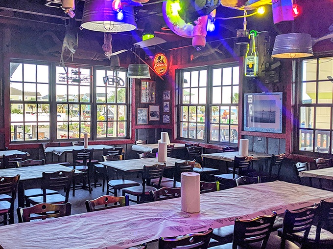 String lights and galvanized bucket fixtures create the perfect backdrop for seafood feasts. No interior designer needed &ndash; just decades of authentic coastal character.