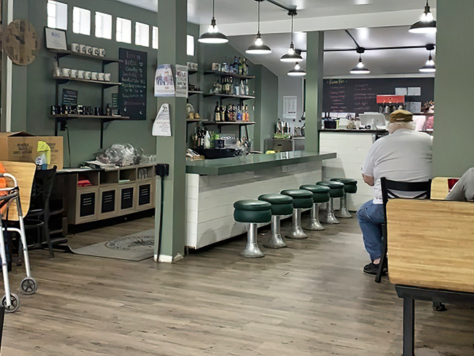 Classic diner aesthetics meet small-town charm with those green vinyl stools practically begging you to swivel while waiting for your morning coffee.