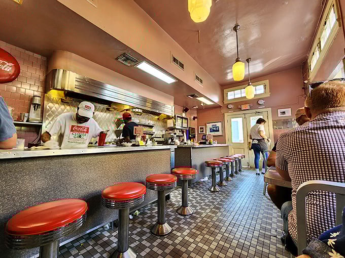Diner perfection: Red vinyl stools, checkered floors, and cooks working their magic behind the counter &ndash; this is breakfast theater at its finest.