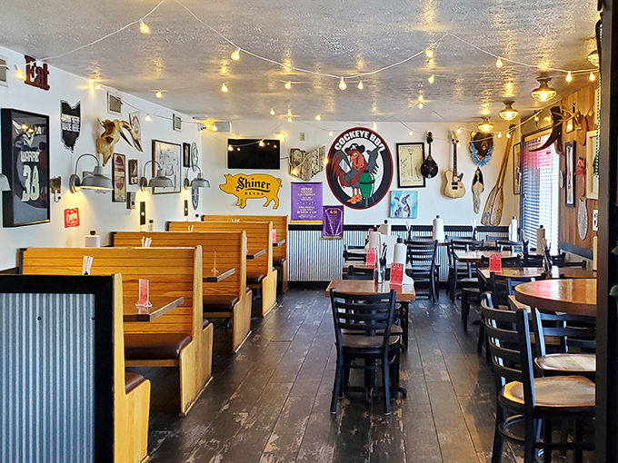 String lights, wooden booths, and walls that tell stories—this isn't just décor, it's a barbecue autobiography written in memorabilia and the lingering scent of hickory.