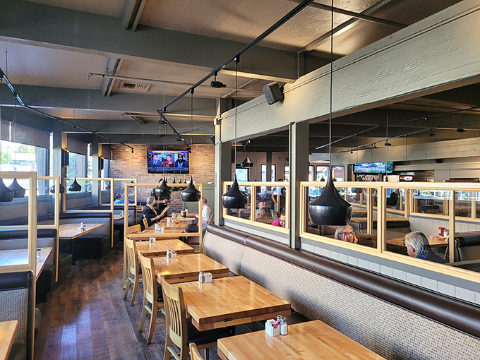 Modern meets cozy in this thoughtfully designed dining space. Wooden tables, comfortable booths, and just enough mirrors to check if you have avocado on your face.