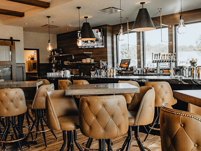 Leather-tufted chairs and warm lighting create the perfect backdrop for serious steak contemplation. This is where beef decisions of consequence are made.