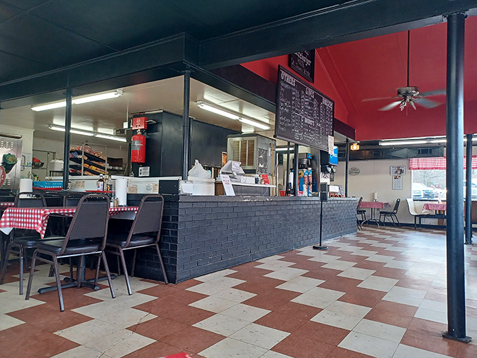 Classic red and white checkered tablecloths meet black and white floor tiles in this time capsule of American dining where memories are made daily.