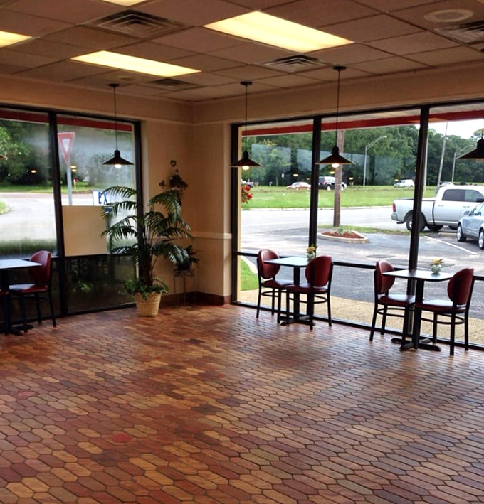 Simple tables, hexagonal floor tiles, and natural light create the perfect stage where the real stars&mdash;those magnificent donuts&mdash;can shine without distraction.