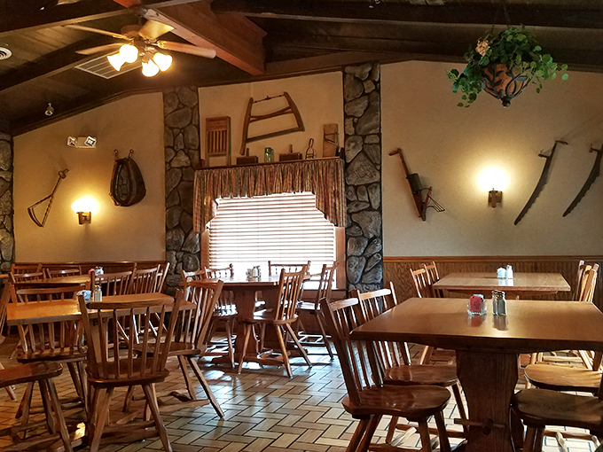 The dining room's stone accents and vintage farm implements create the perfect backdrop for serious eating &ndash; like dining in your outdoorsy uncle's trophy room.