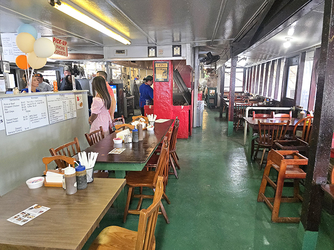 The narrow, diner-style interior with its green floor and wooden tables feels like the barbecue equivalent of Grandma's kitchen - comfortable, familiar, and promising good things.