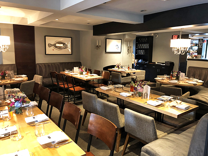 Elegant simplicity defines Savona's dining room, where that fish artwork watches over patrons about to embark on Mediterranean flavor journeys.