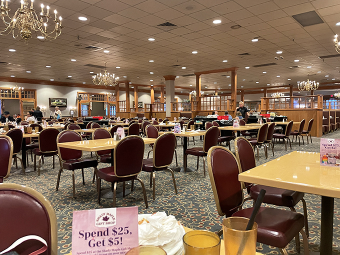 Inside, chandeliers cast a warm glow over a dining room that could host a small village. Your stomach is already sending thank-you notes.