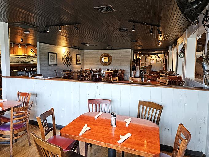 Wooden ceilings, nautical accents, and tables set for seafood adventures &ndash; this isn't just dining, it's a maritime experience waiting to happen.