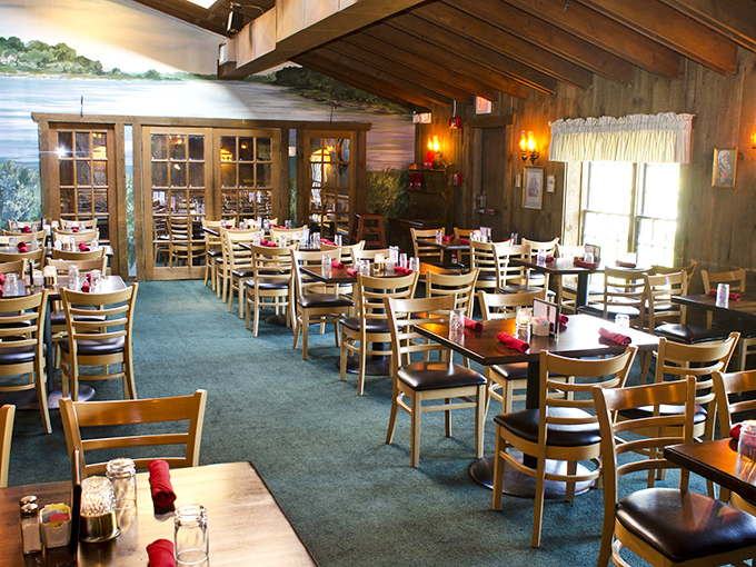 Exposed beams and waterfront views create the kind of honest, comfortable atmosphere where steaks take center stage.