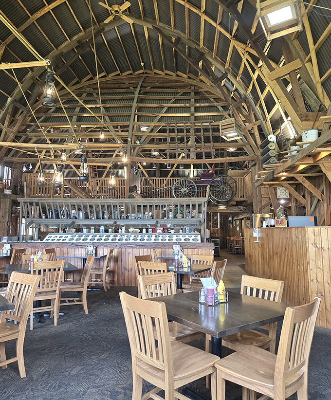 Soaring wooden beams and rustic charm create a cathedral-like dining space where calories don't count and conversations flow as freely as the gravy.