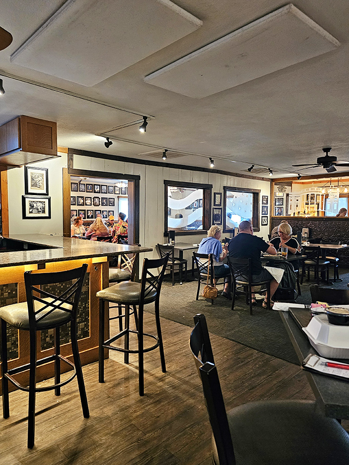 Inside, wood-paneled warmth and nostalgic photographs create the perfect backdrop for the food drama about to unfold at your table.