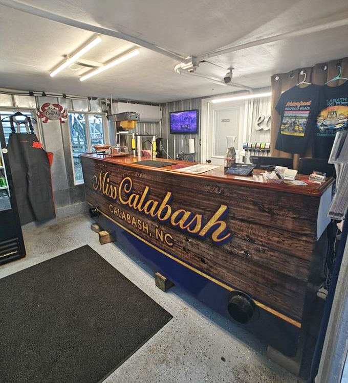 Behind this rustic "Miss Calabash" counter, seafood dreams come true. No fancy marble tops needed when the food speaks volumes.