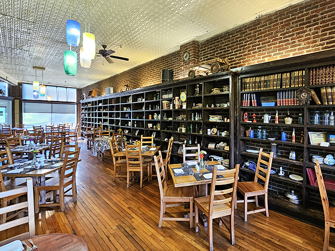 Exposed brick and vintage shelving create the perfect backdrop for conversations that last longer than your empty plates.