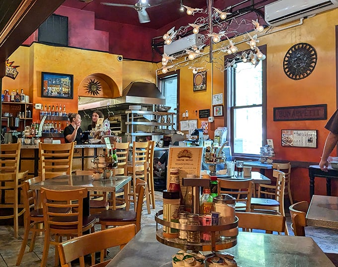 Golden walls and wooden chairs create the perfect backdrop for your morning culinary adventure.