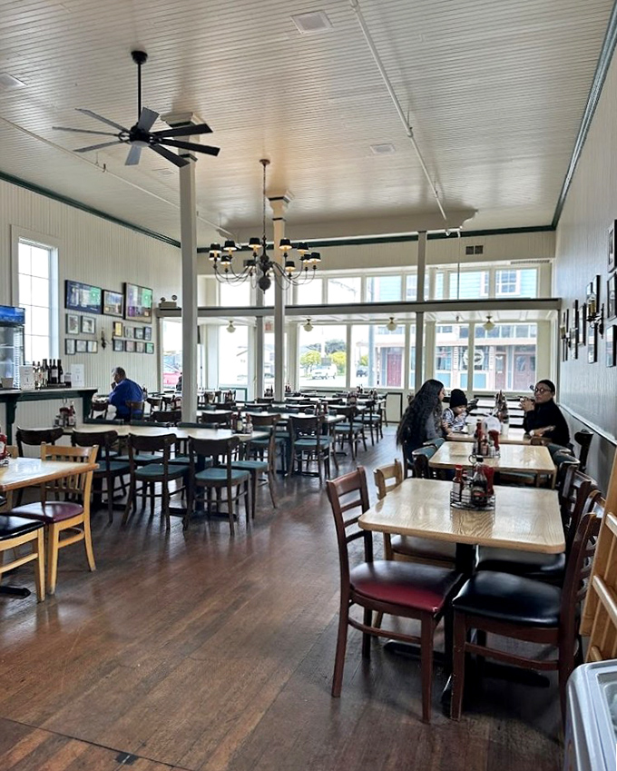 Spacious yet cozy, the dining room balances maritime charm with practical comfort. Those ceiling fans have witnessed countless "first bite" expressions of pure joy.