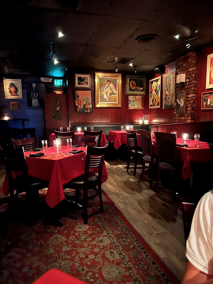 Red walls and vintage art create the perfect backdrop for conversations that actually matter&mdash;remember those?