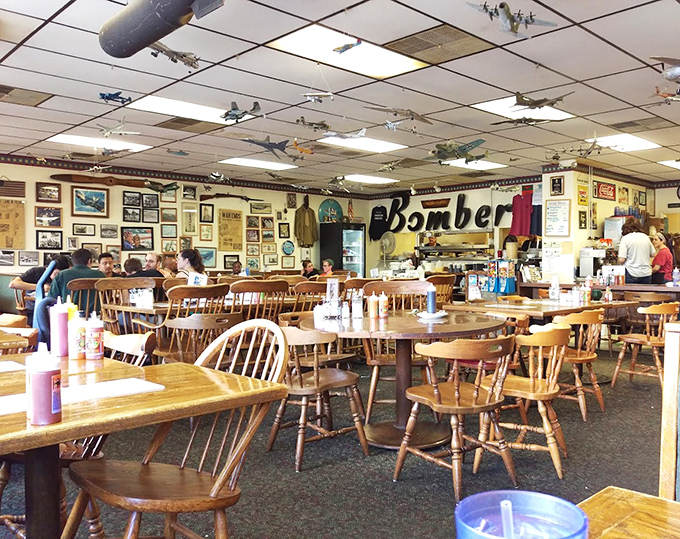 This interior shot captures the Bomber's charm &ndash; where model planes supervise your meal like tiny breakfast guardians.