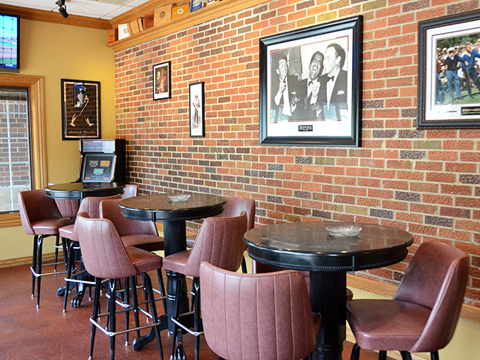Those mauve chairs against exposed brick create the perfect backdrop for conversations that last until closing time.