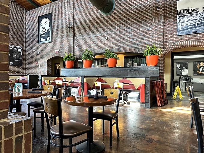 The exposed brick interior whispers stories while those terracotta pots add warmth that feels like Sunday dinner at grandma's.