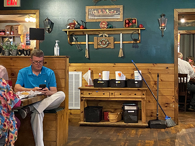 That cozy interior whispers "come as you are" while the teal walls shout "stay for dessert!"